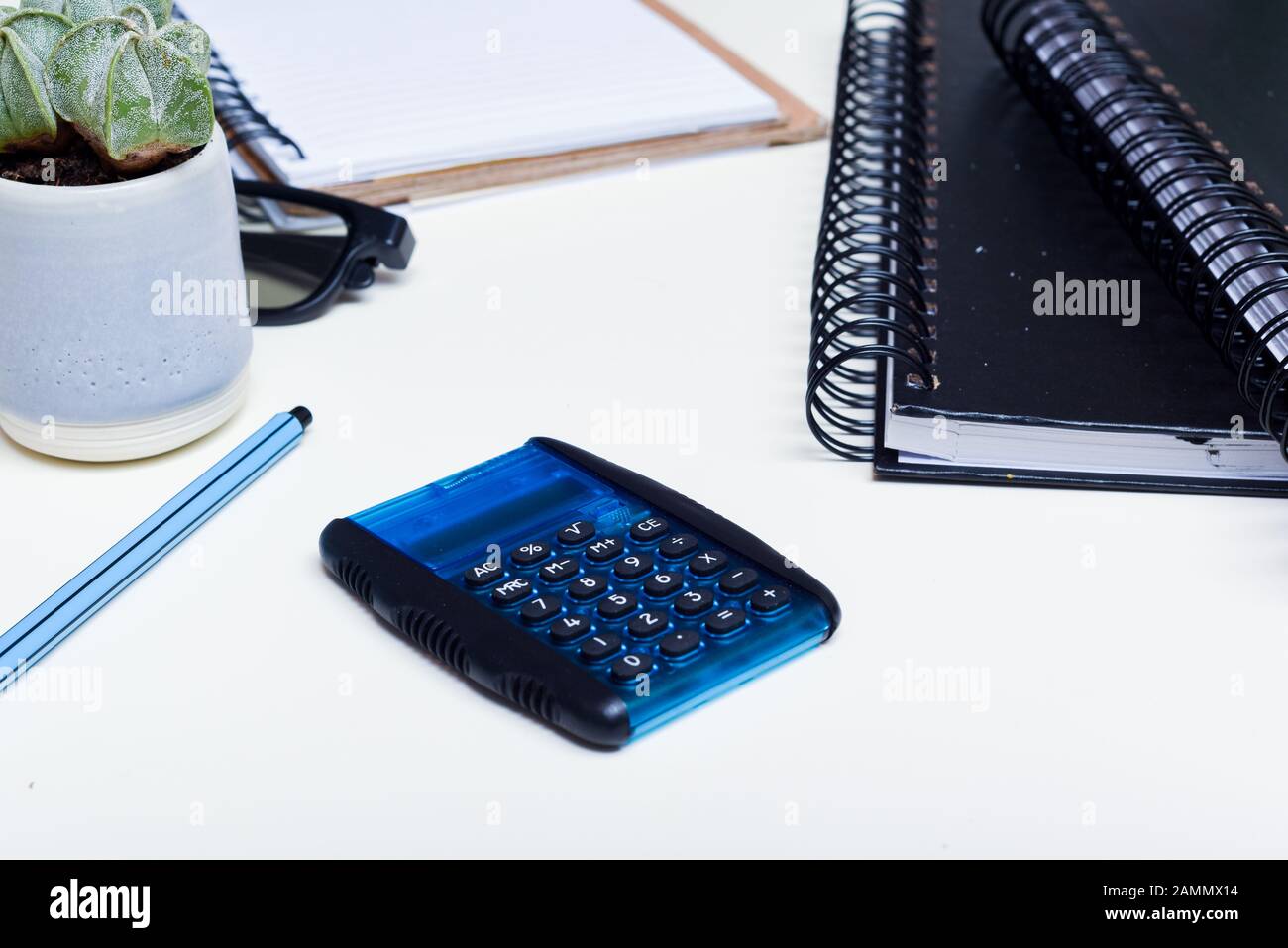 Calculating tax return numbers and figures on office desk concept for ...