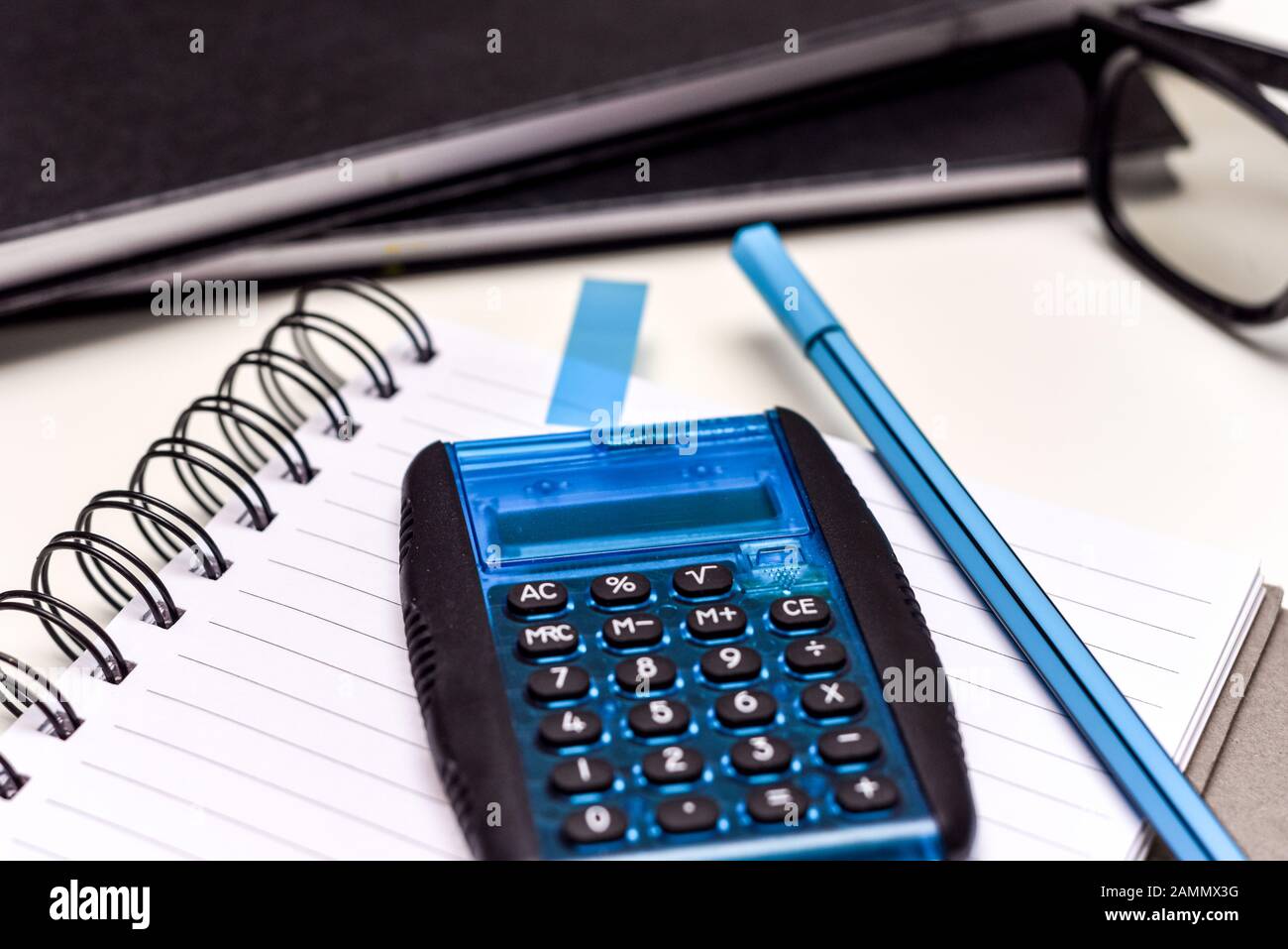Calculating tax return numbers and figures on office desk concept for ...