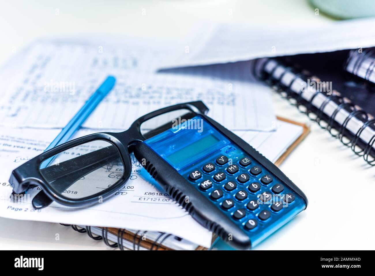 Calculating tax return numbers and figures on office desk concept for ...
