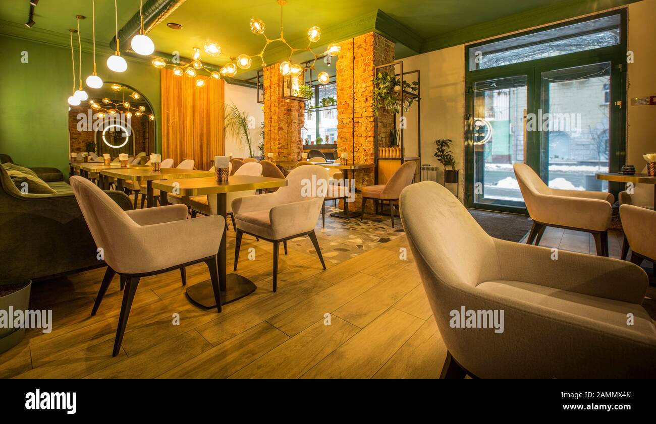 Urban cafe interior with cozy atmosphere, avocado color walls Stock ...