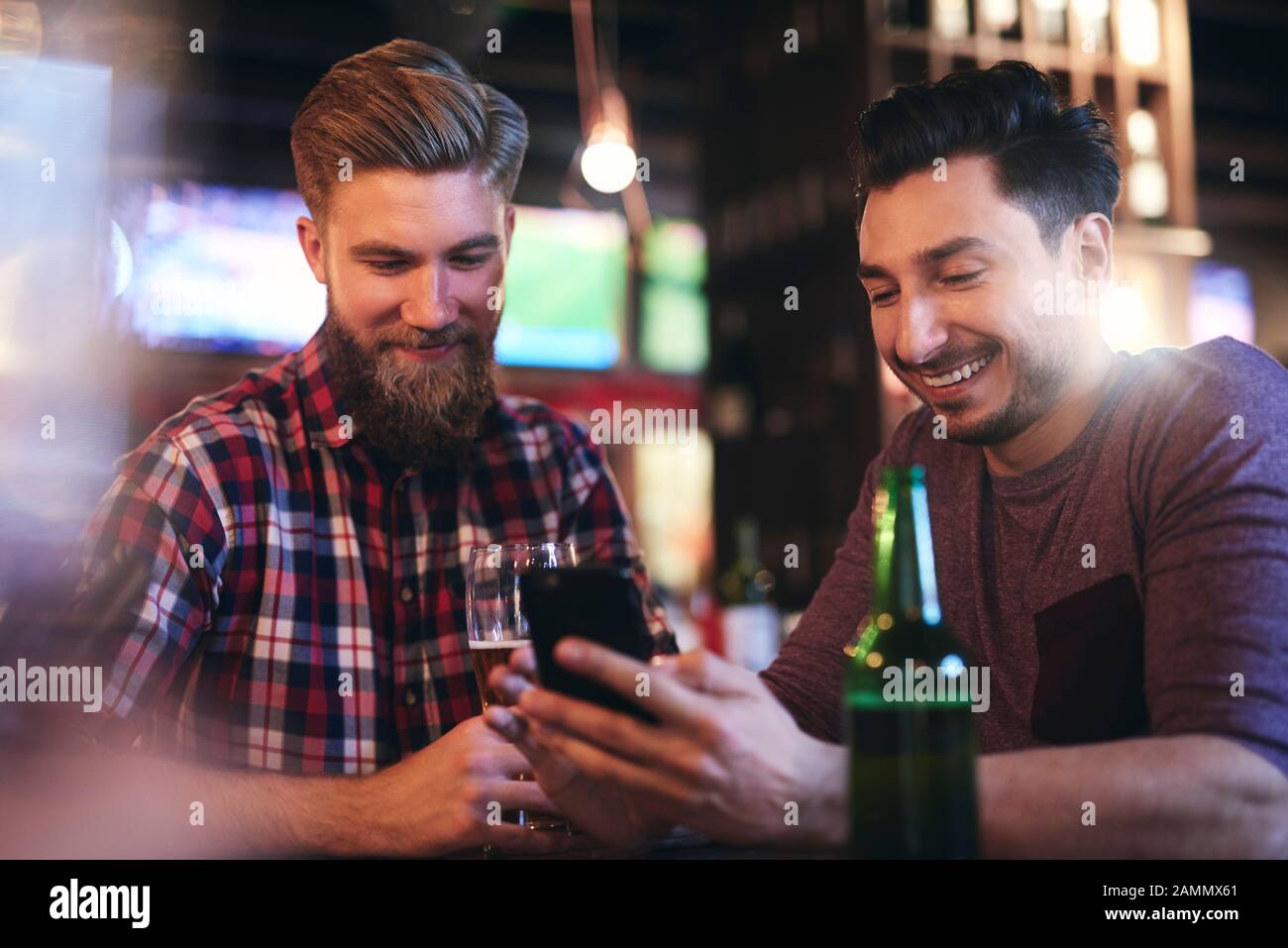 Two men in pub mobile hi-res stock photography and images - Alamy