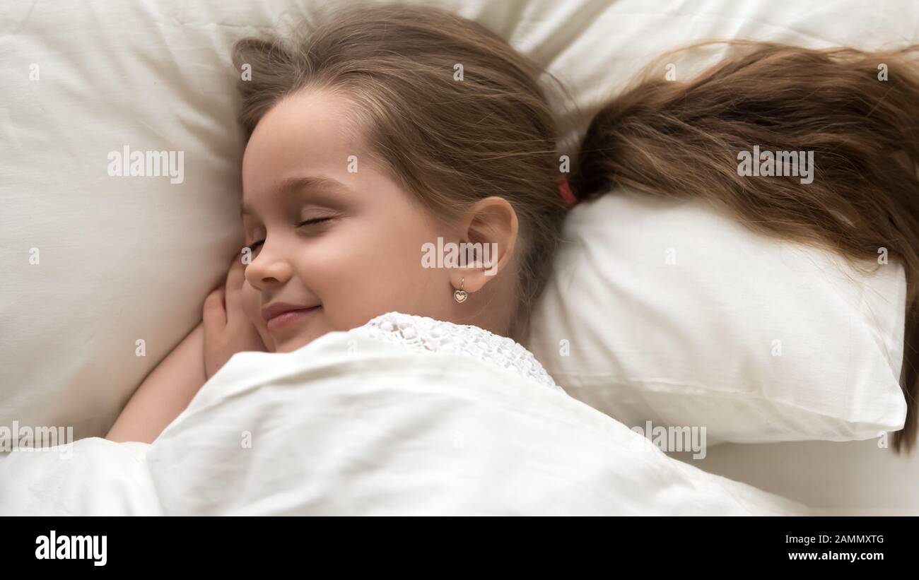Little girl sleeping sheet hi-res stock photography and images - Alamy