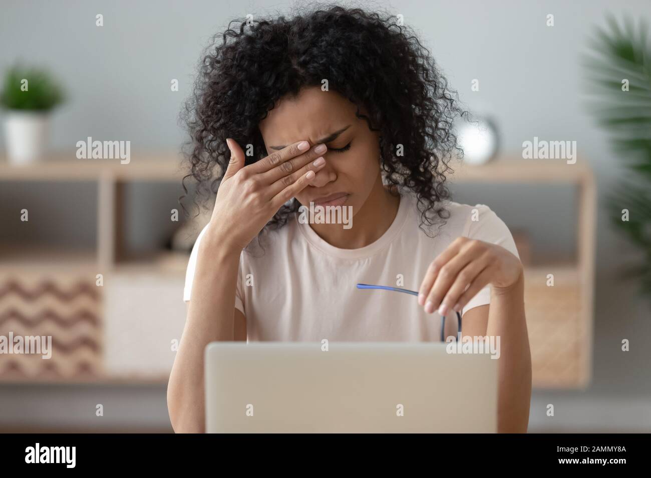 African woman taking off hi-res stock photography and images - Alamy