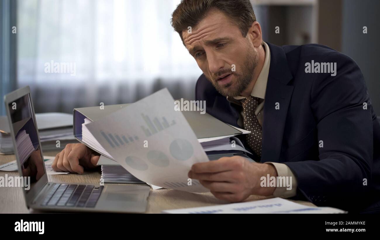 Surrounded by paperwork hi-res stock photography and images - Alamy