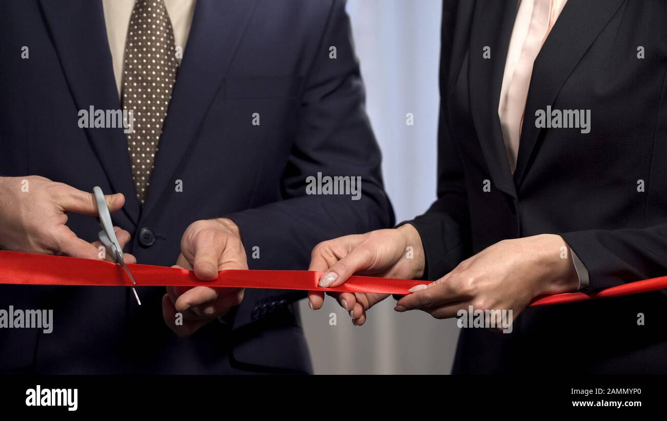 Ribbon cutting ceremony man scissors hi-res stock photography and ...