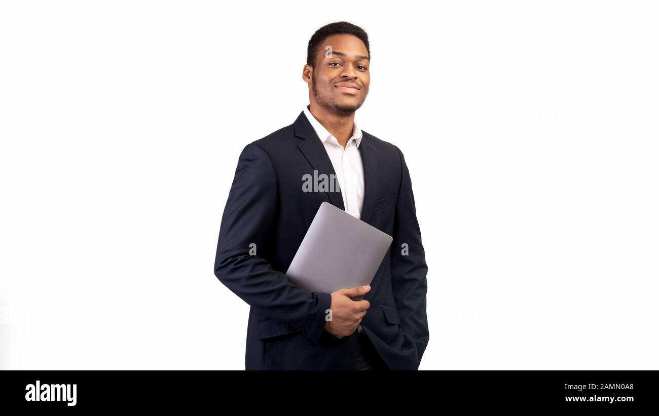 Handsome black man holding laptop on white background Stock Photo - Alamy