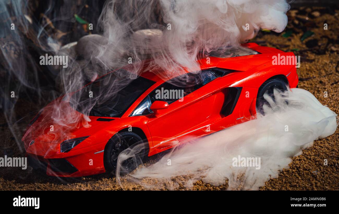 The toy car and smoke Stock Photo - Alamy
