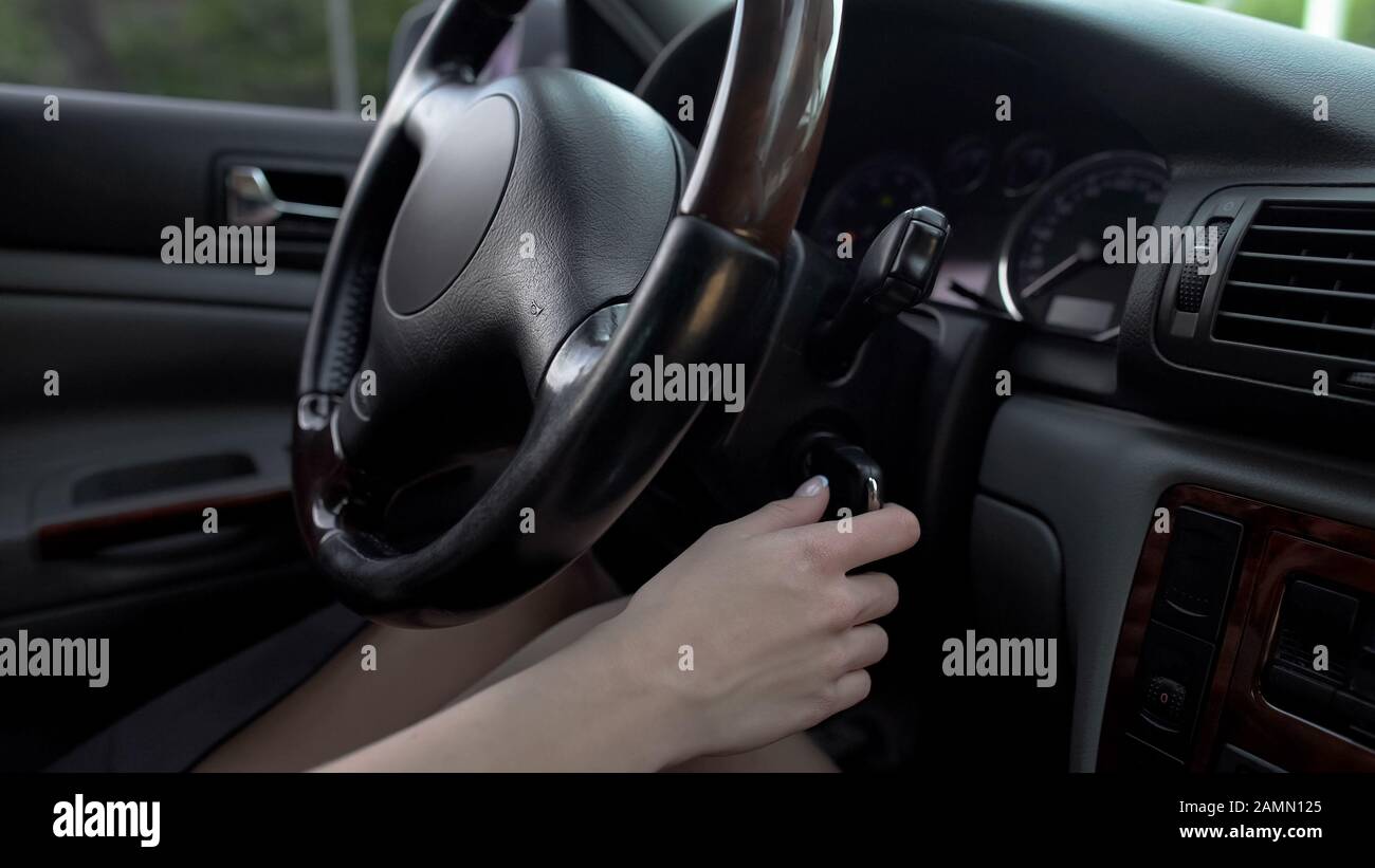 Closeup woman starting car hi-res stock photography and images - Alamy