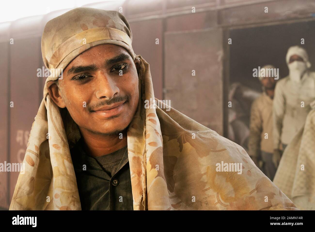 Man wearing only head scarf and neck and should cloth protection ...