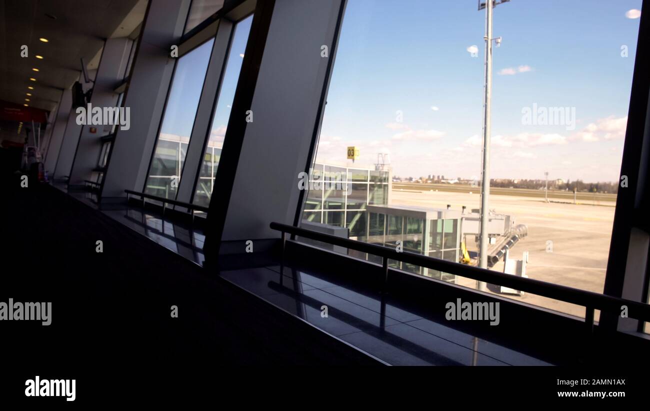Modern airport, beautiful view of runway and passenger terminal through ...