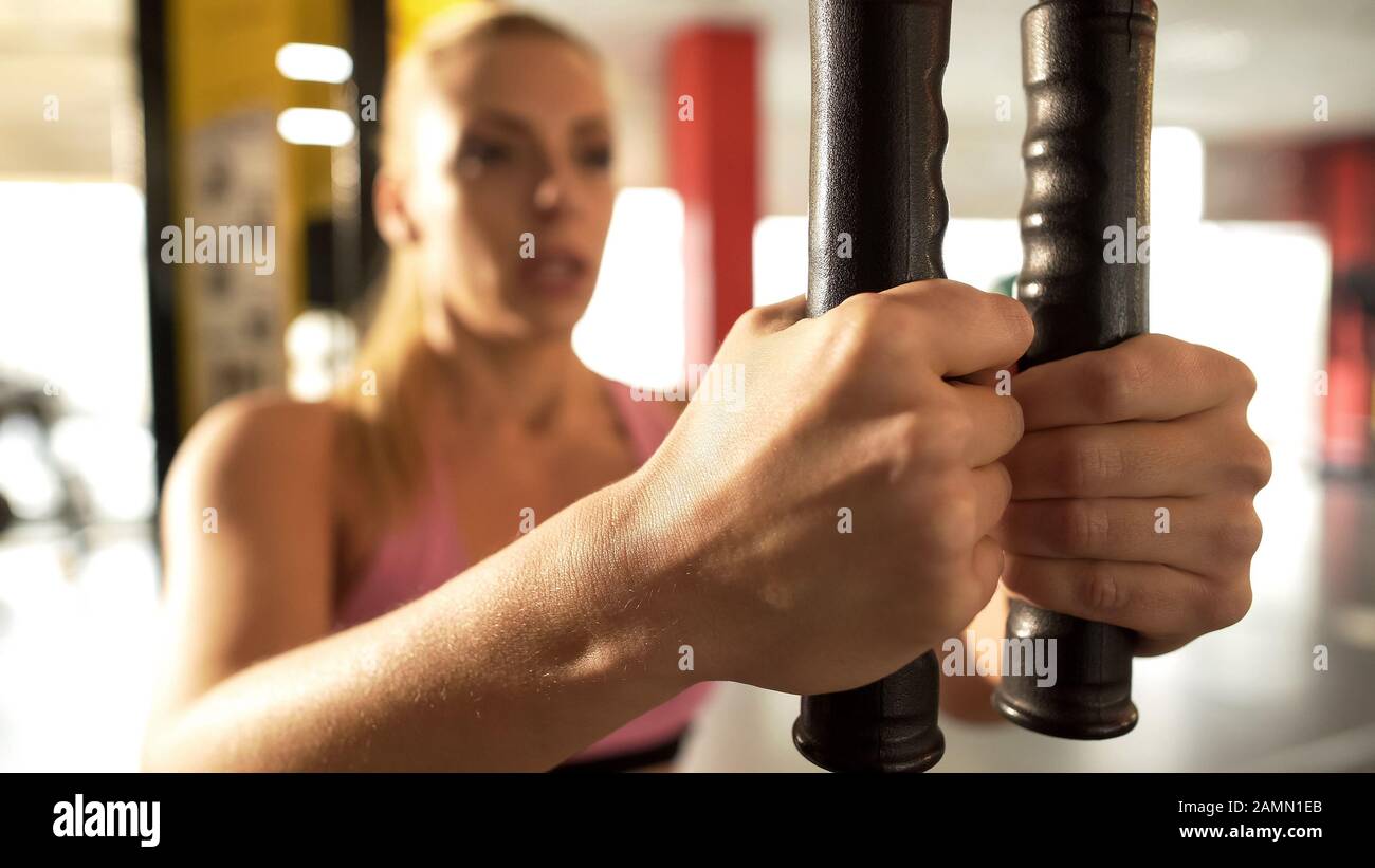 Woman doing pectoral fly exercise gym, hands close-up, proper exercise ...