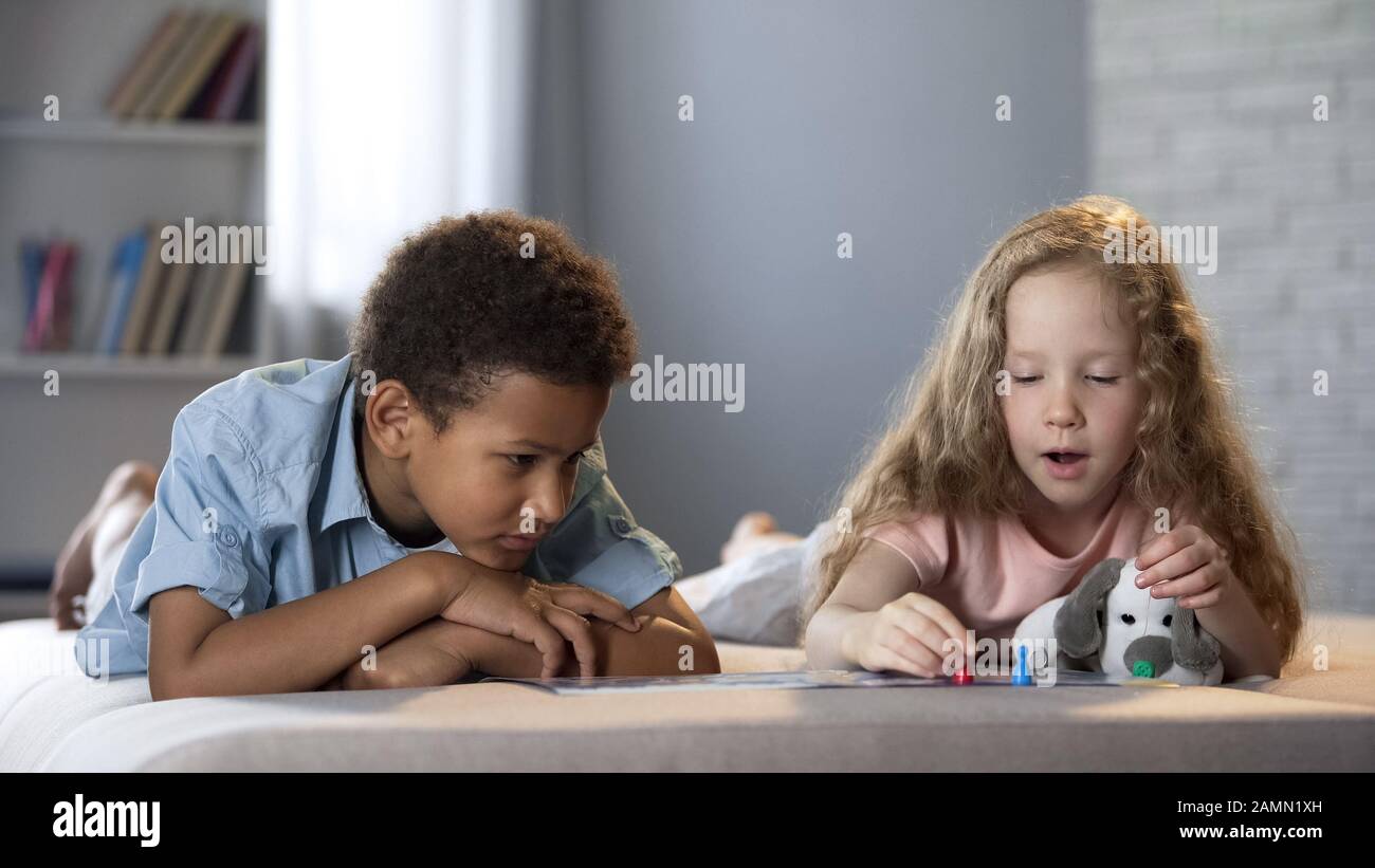 Best multi-ethnic friends playing educational board games learning to ...
