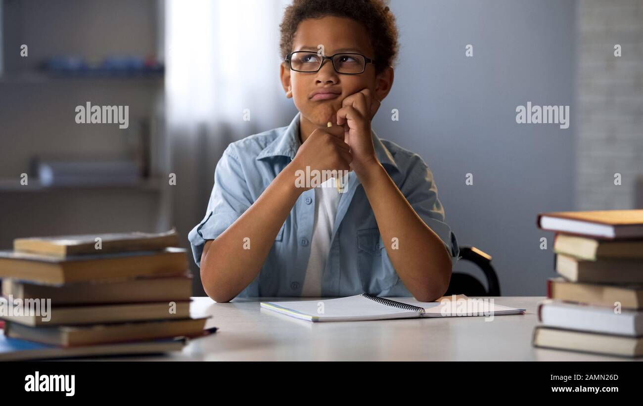 African boy writing desk hi-res stock photography and images - Alamy