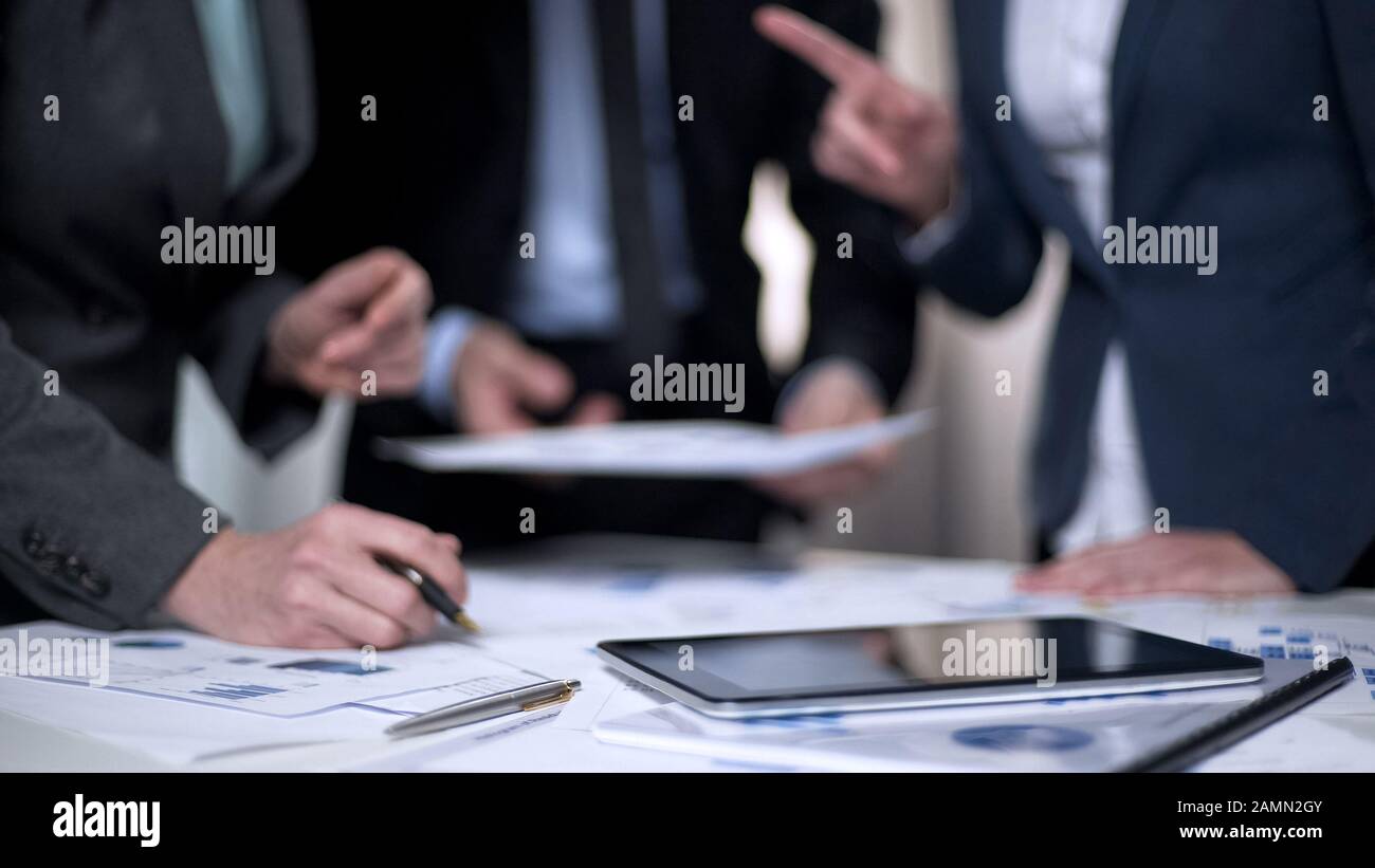 Business consultant giving advice to managers, discussing development ...