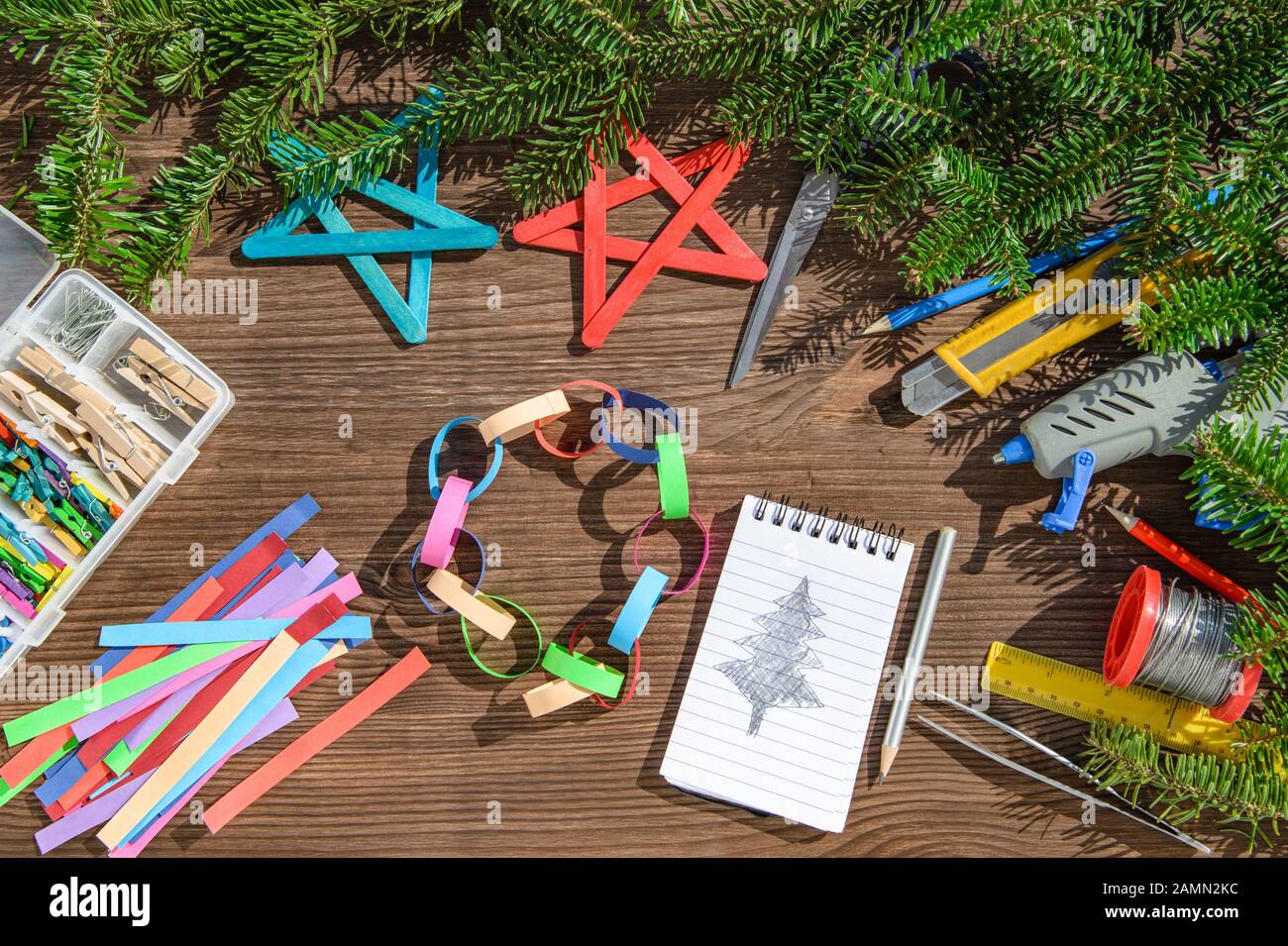 christmas decoration DIY craft background with tools and pine branches ...