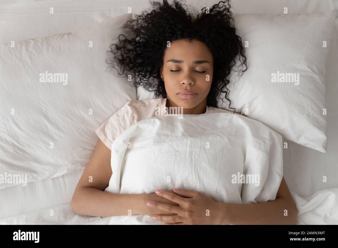 African woman sleeping in bed close up top view Stock Photo - Alamy
