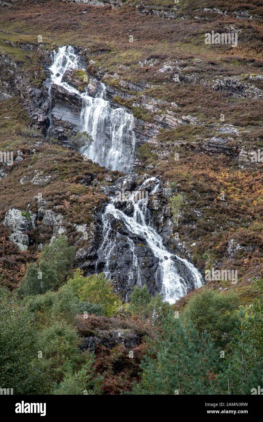 Waterfall down the mountain Stock Photo - Alamy