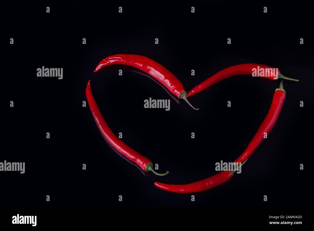 Heart shape made of hot chili peppers Stock Photo - Alamy