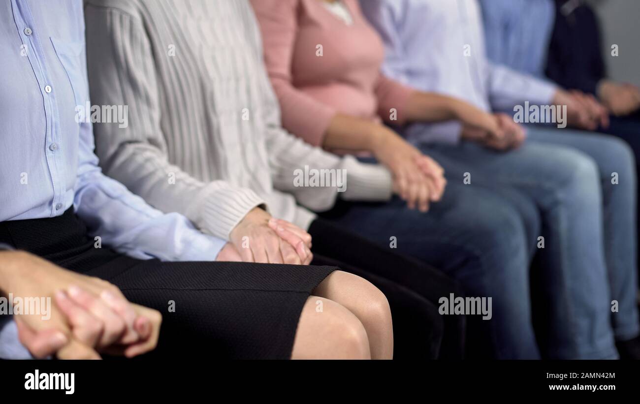 Sitting holding hands therapy hi-res stock photography and images - Alamy