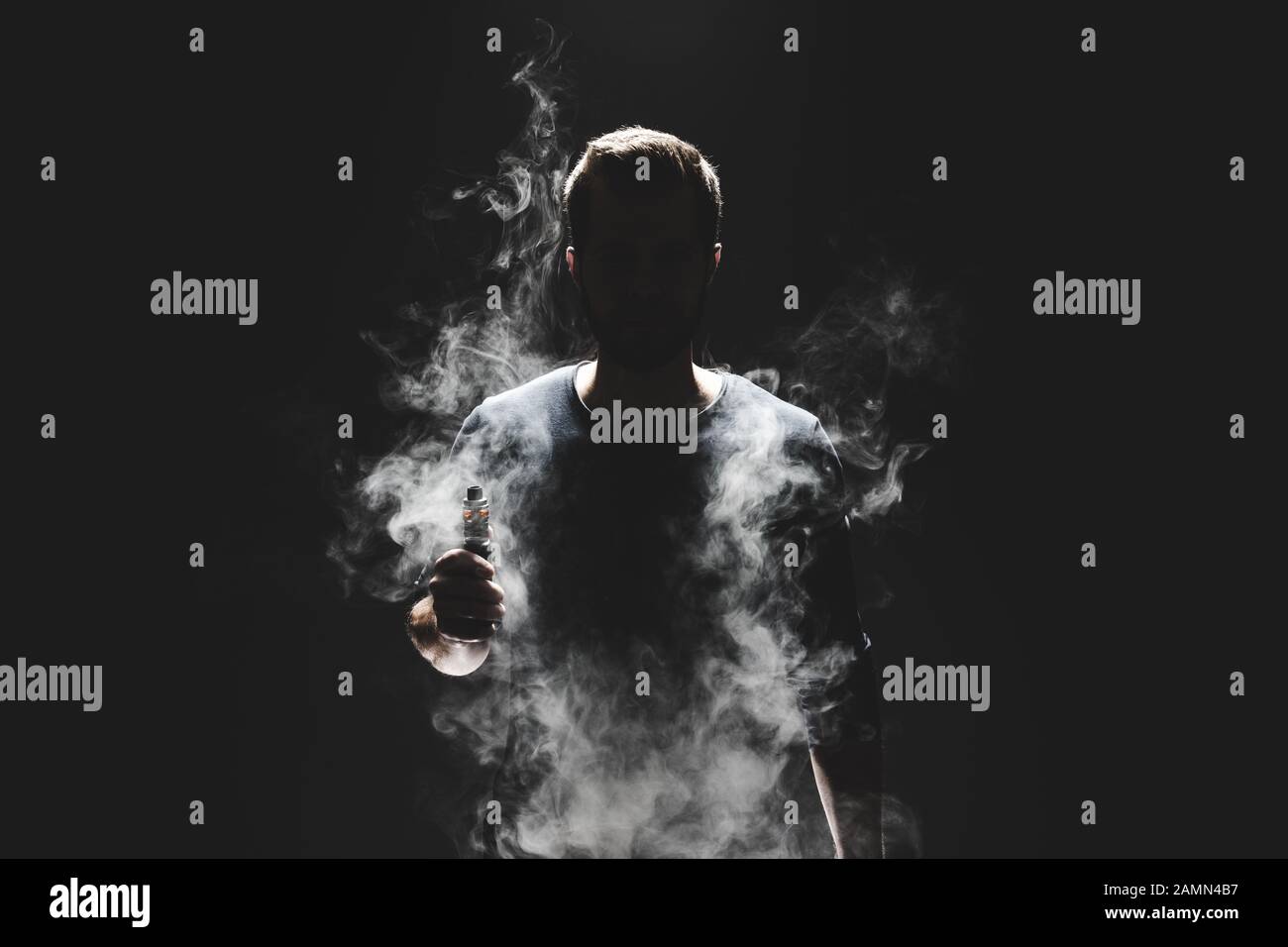 Vaping flavored e-liquid from an electronic cigarette Stock Photo - Alamy