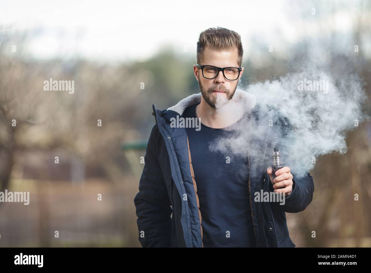 Vaping flavored e-liquid from an electronic cigarette Stock Photo - Alamy