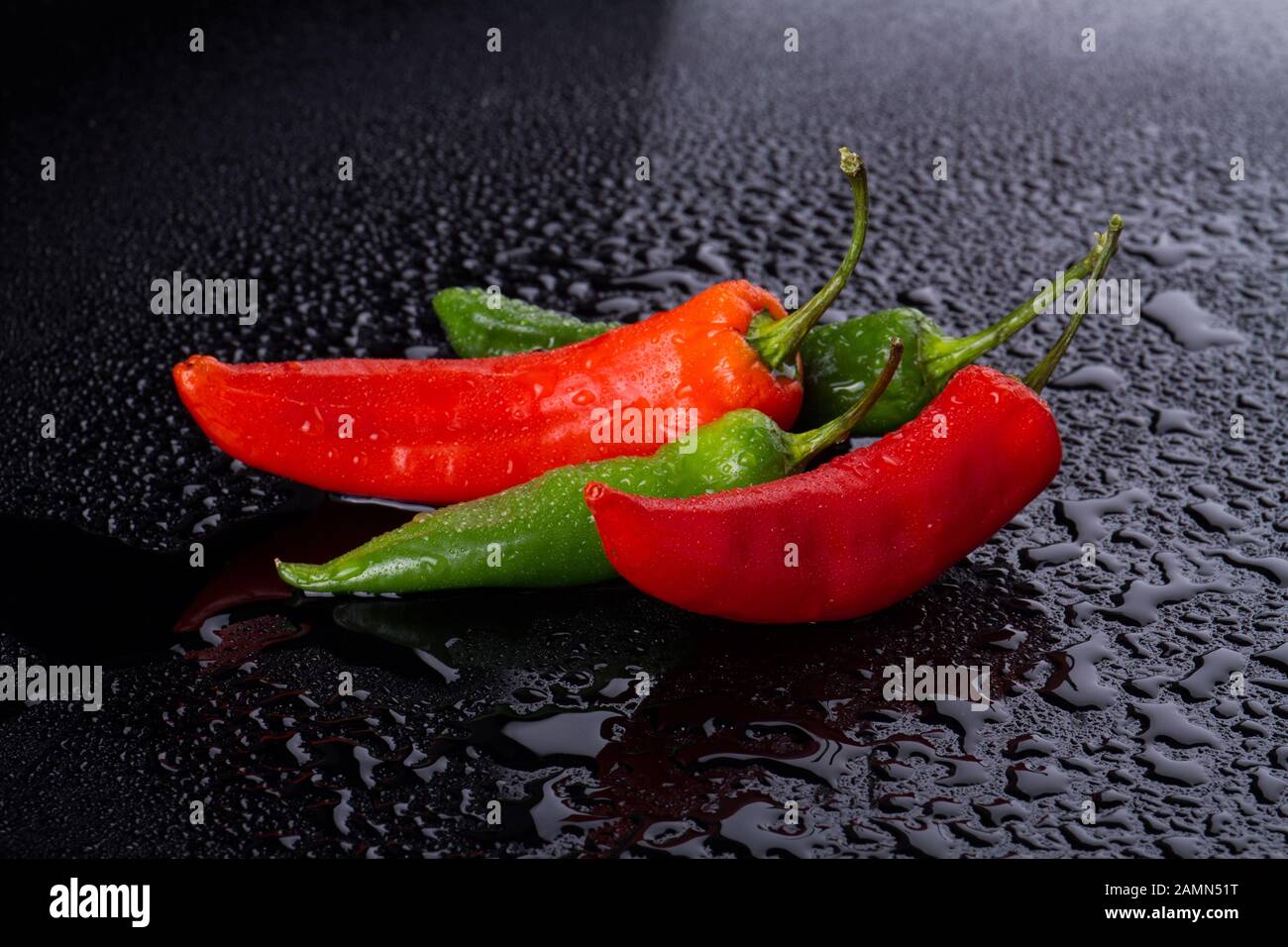Multi-colored quartet of chili peppers Stock Photo - Alamy