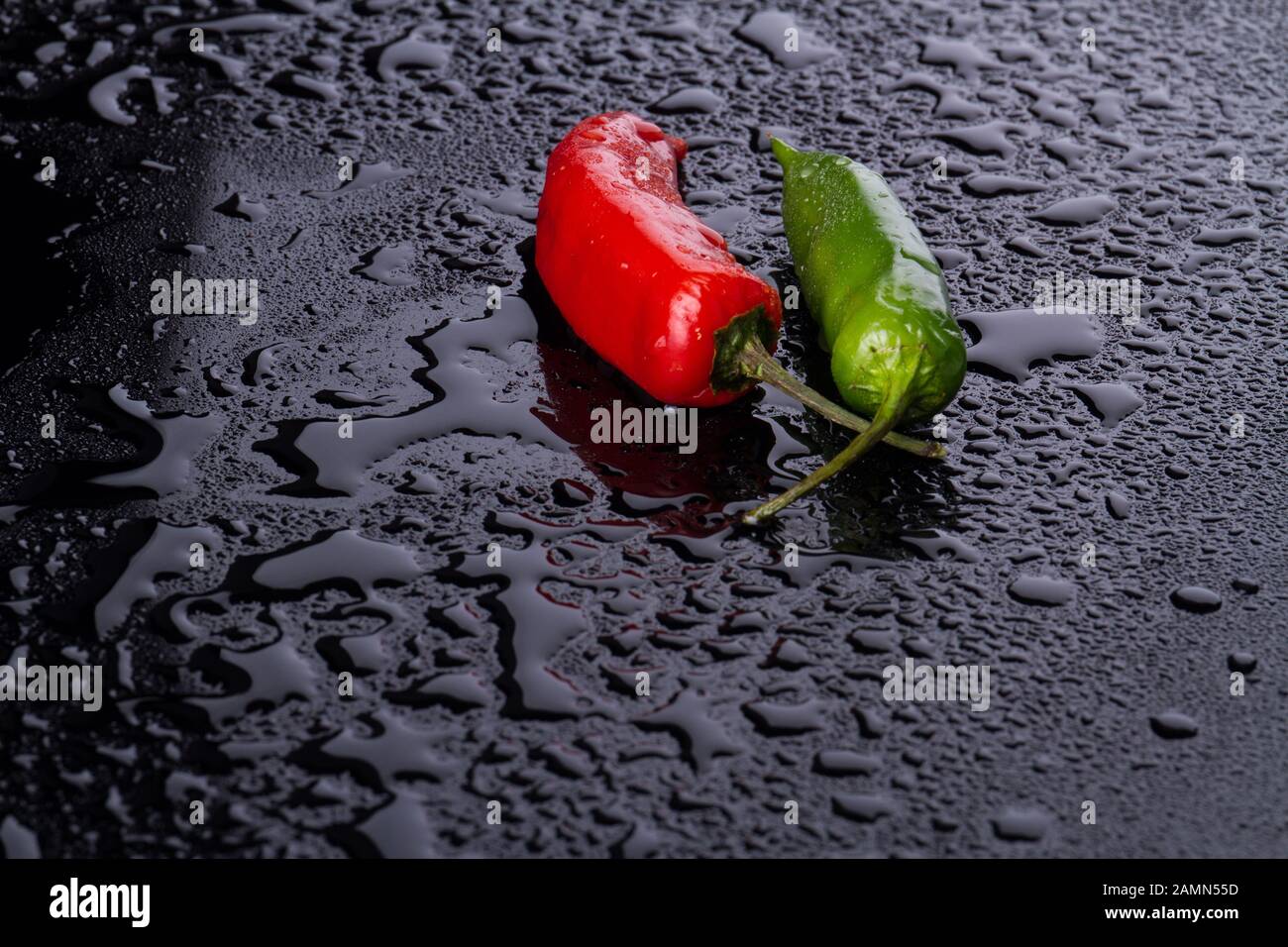Chili peppers like lovers in focus Stock Photo - Alamy