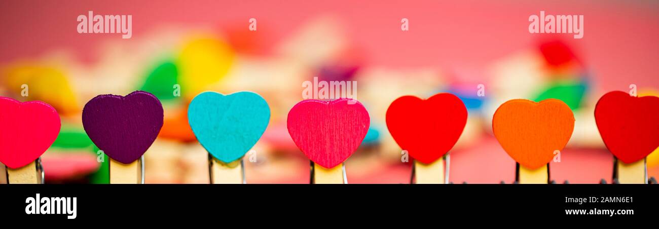 Beauty Colorful mini hearts with other color blur pink background and ...
