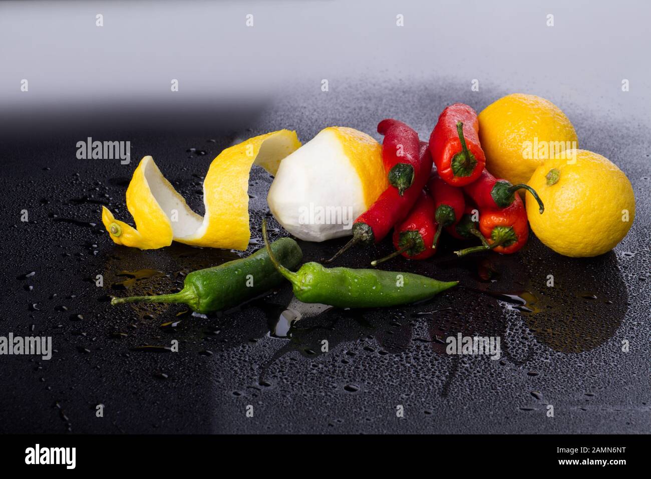 Bunch of chili and lemon trio Stock Photo - Alamy