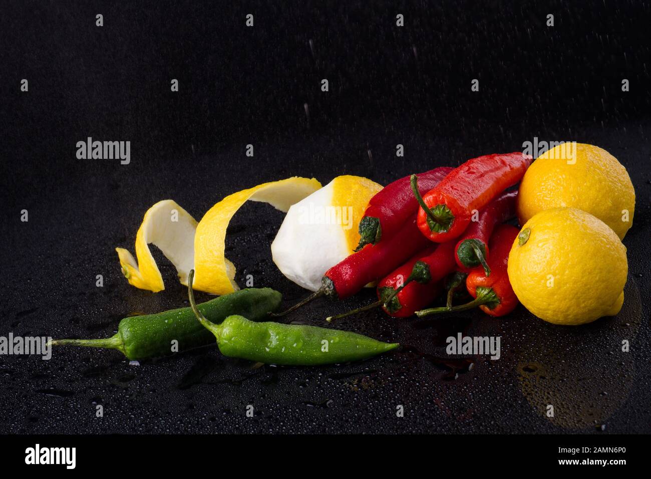 Green chili and peeled lemon Stock Photo - Alamy