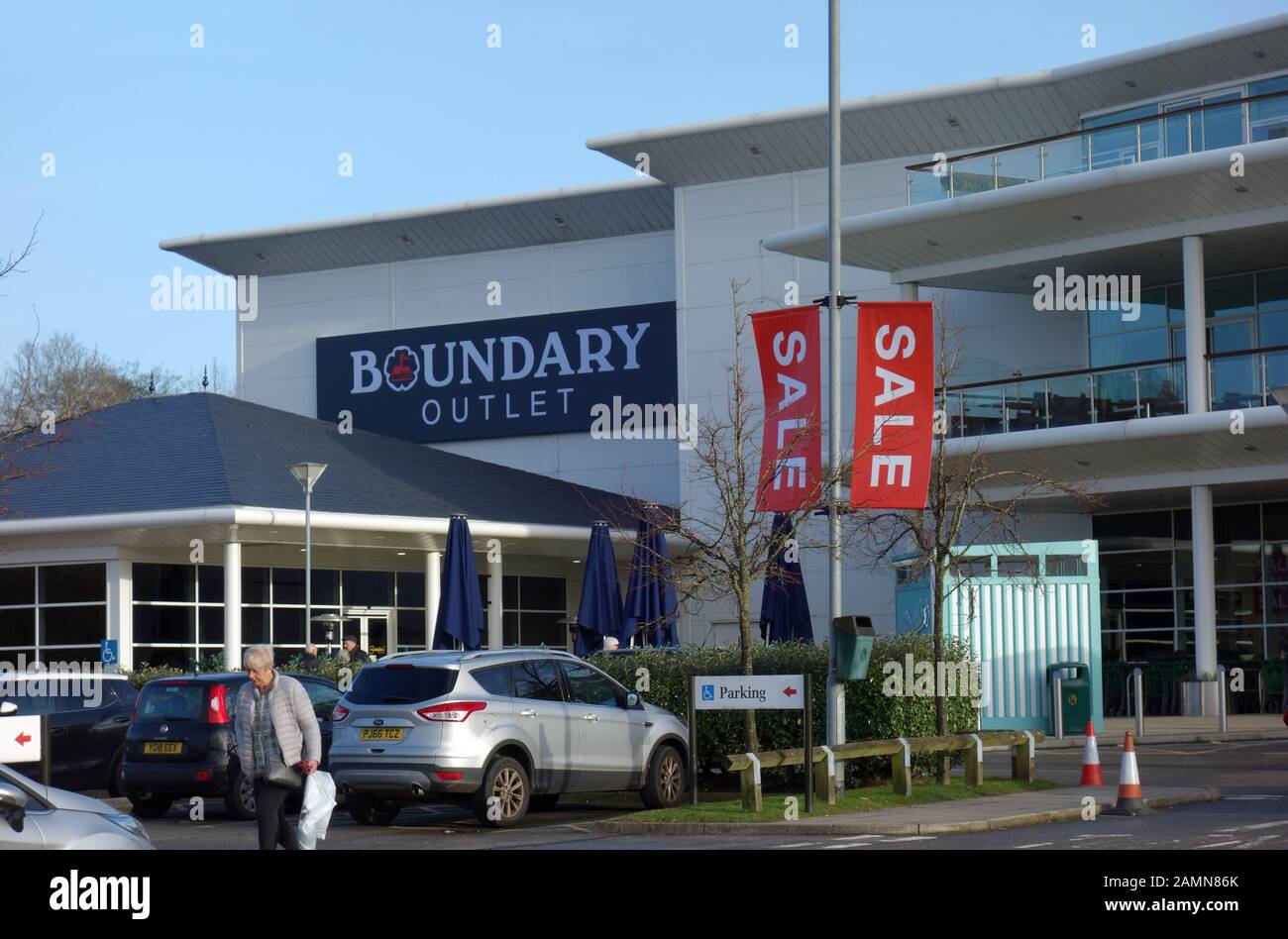 Woman Shopper by Parked Cars Outside Boundary Mills Retail Shopping ...