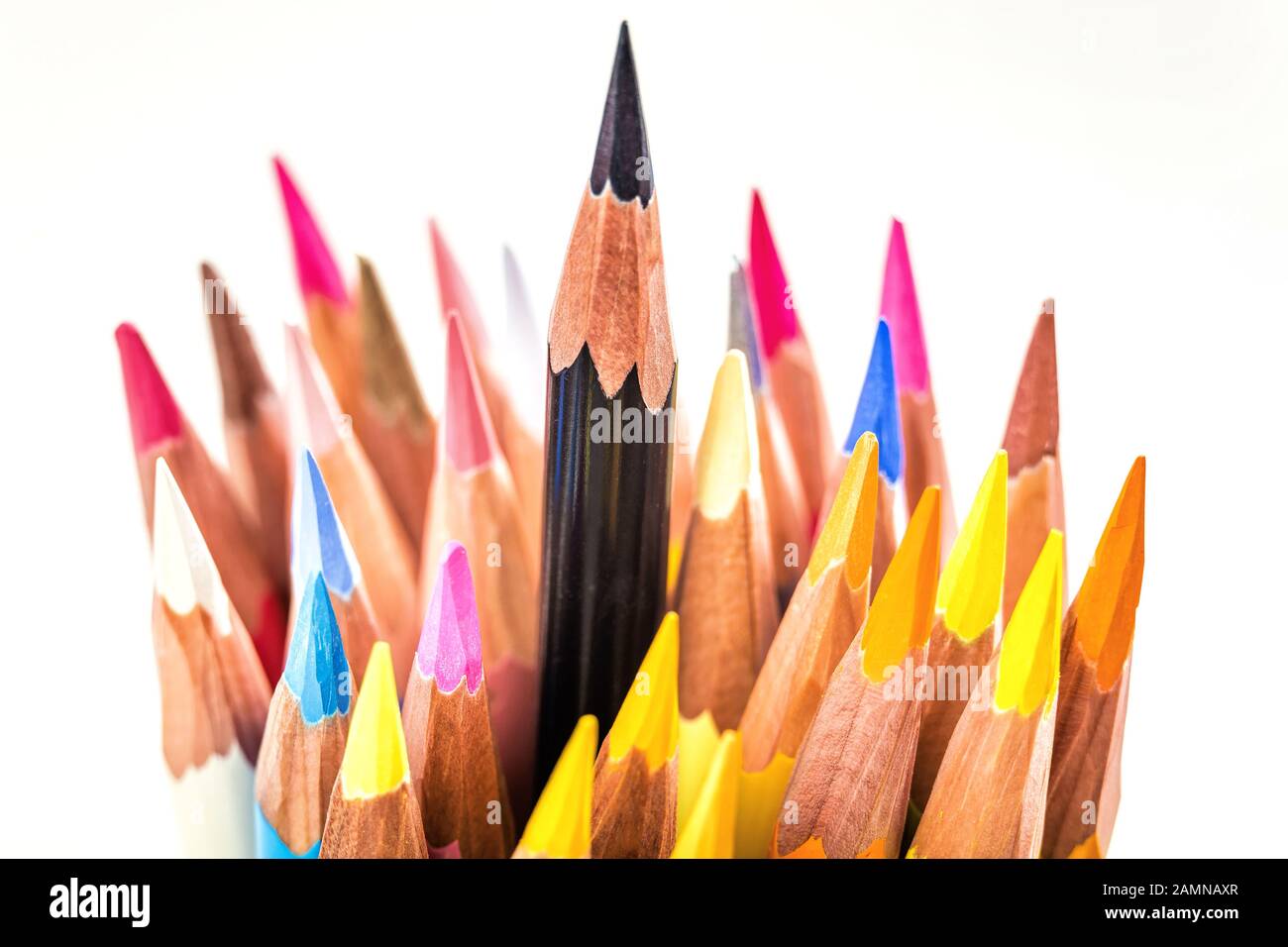 Standing out from the crowd concept with black pencil on white ...
