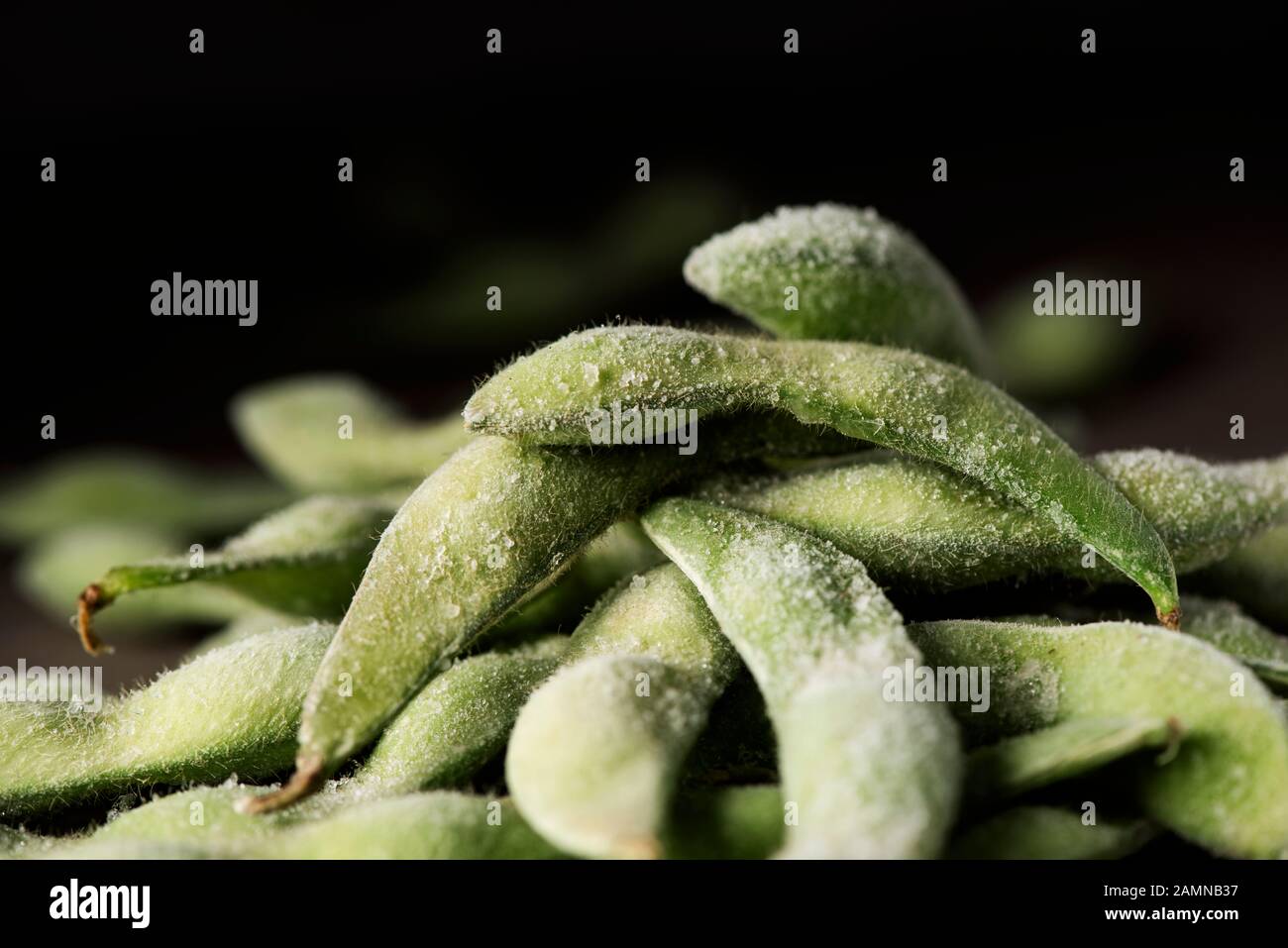 closuep of a pile of frozen edamame, japanese green soybeans in the pod ...