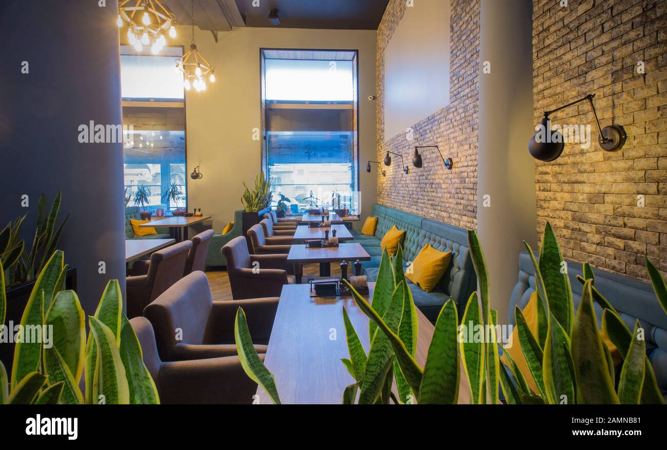 Modern restaurant interior in loft style with bricks walls Stock Photo ...