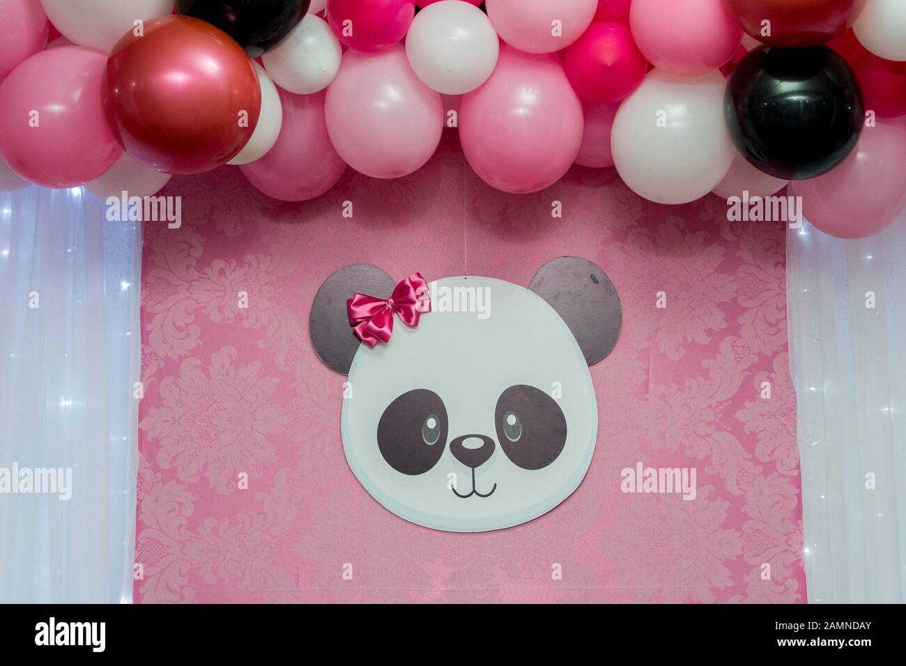 Pink banner with arabesques and face of a female panda Stock Photo - Alamy