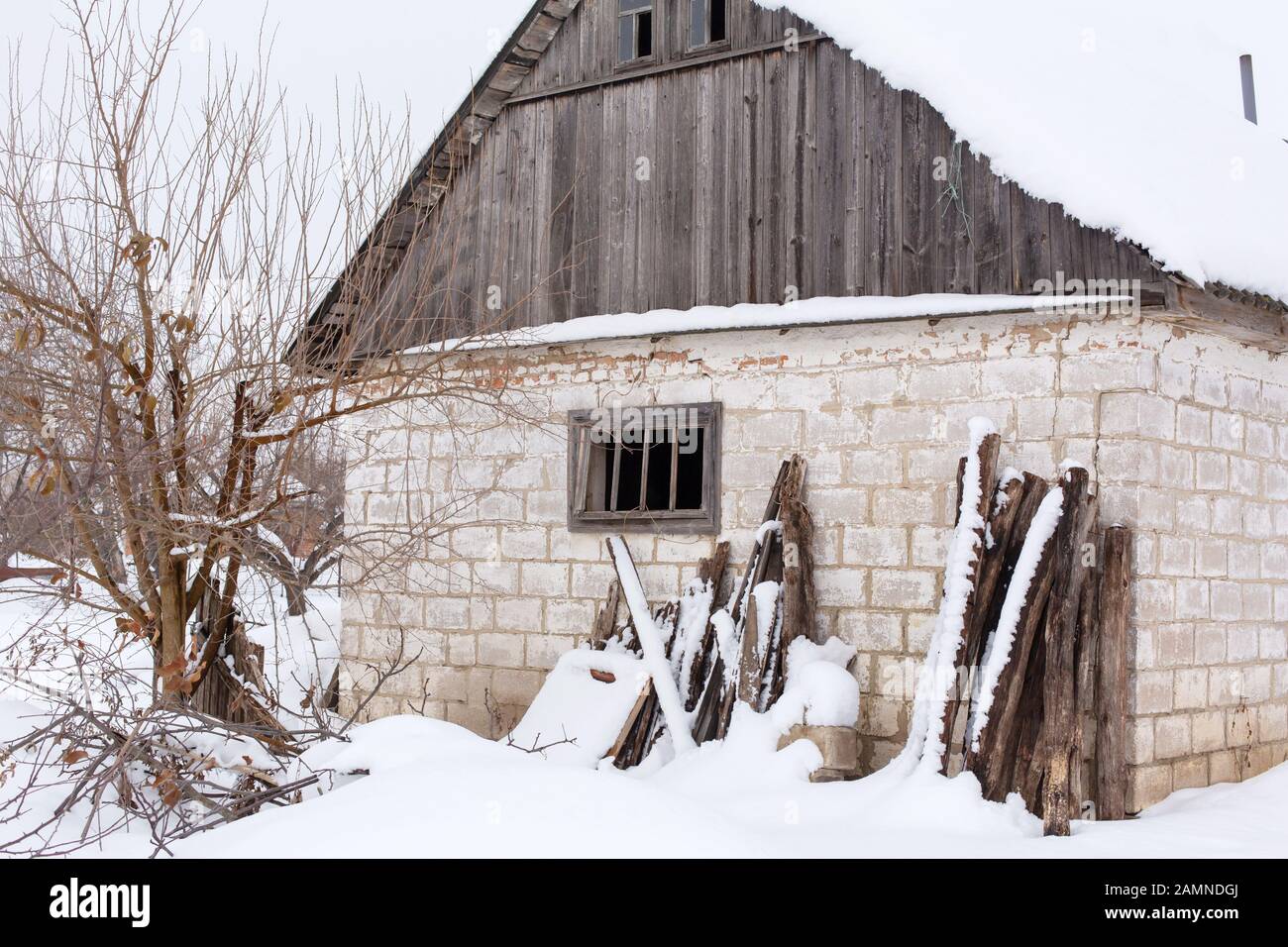 Winter countryside landscape, dilapidated abandoned ruined building ...