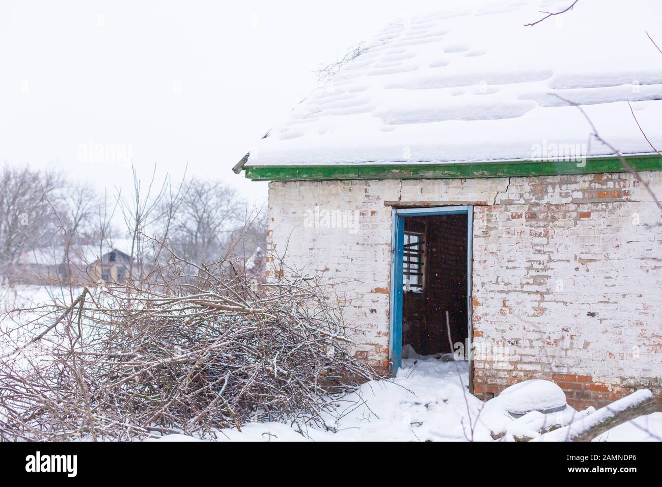 Winter countryside landscape, dilapidated abandoned ruined building ...