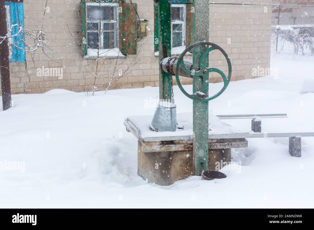 Winter. An old water well is covered in snow Stock Photo - Alamy