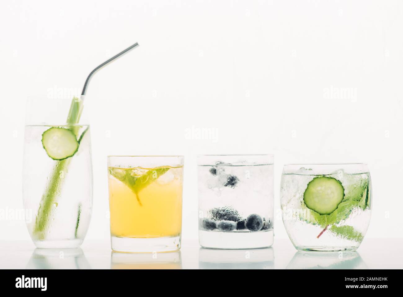 refreshing drinks with blueberries, celery, straw, mint, cucumber and ...