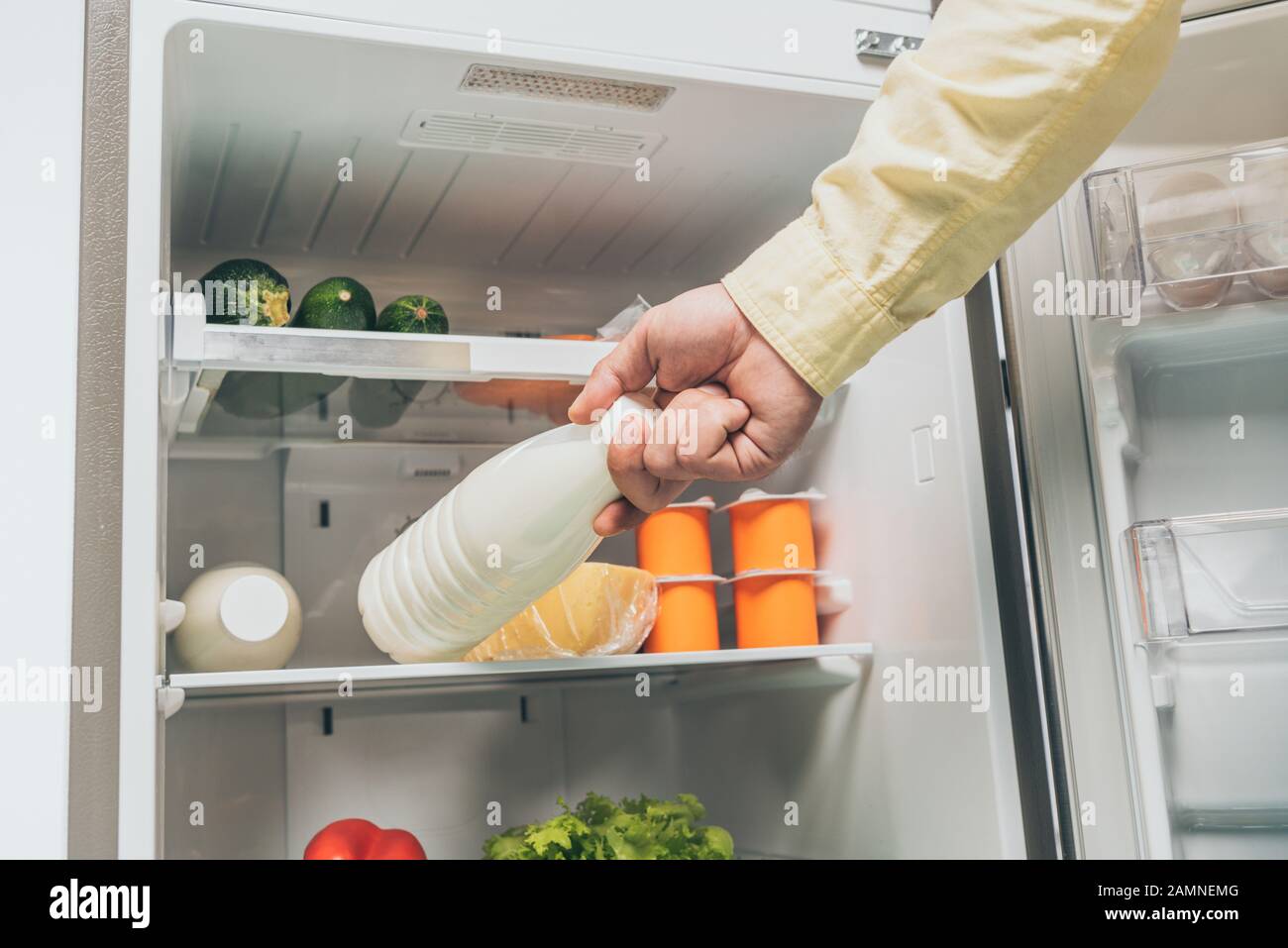 Putting food in the refrigerator hi-res stock photography and images ...