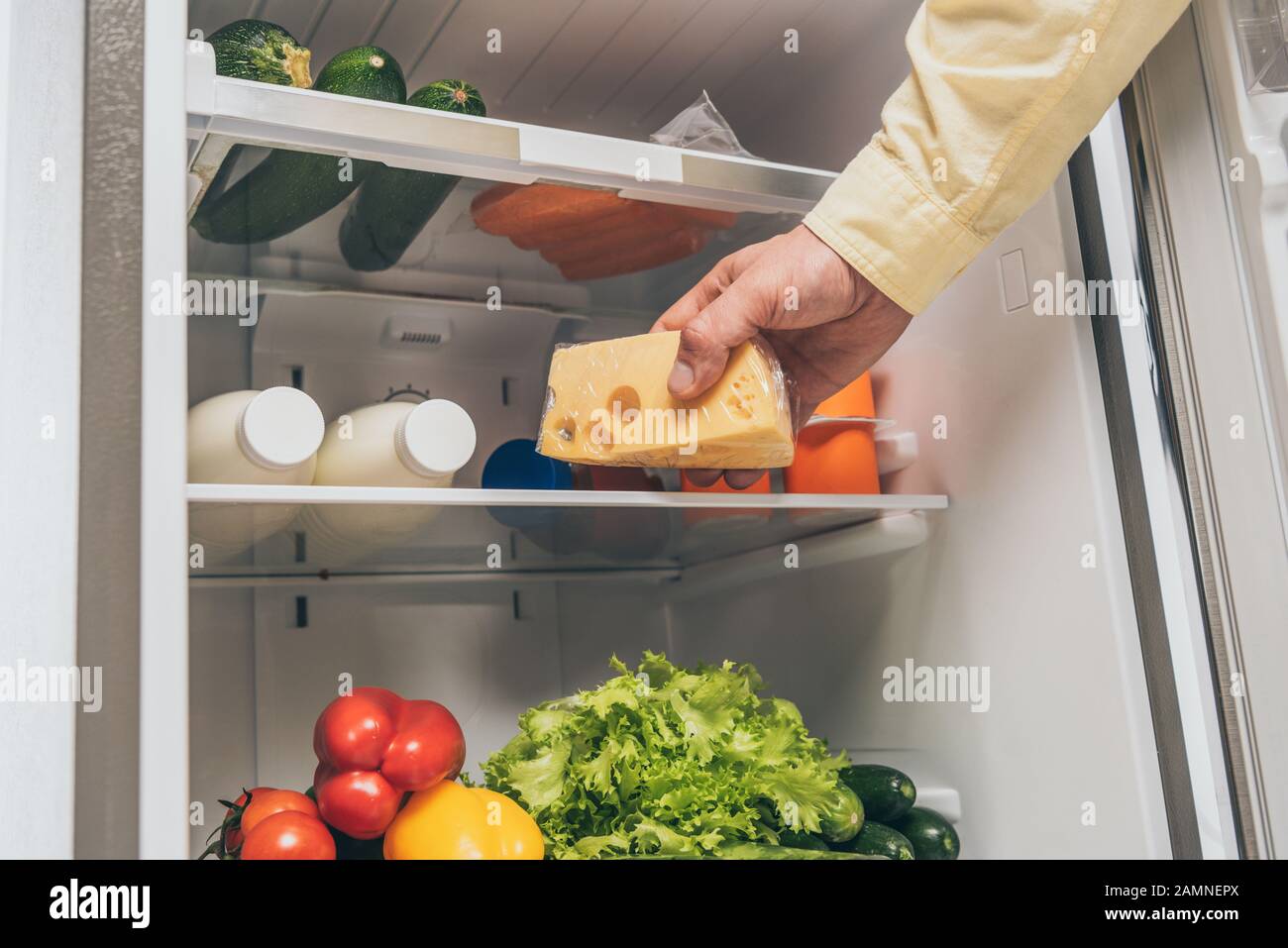 Man taking drink out of fridge hi-res stock photography and images - Alamy