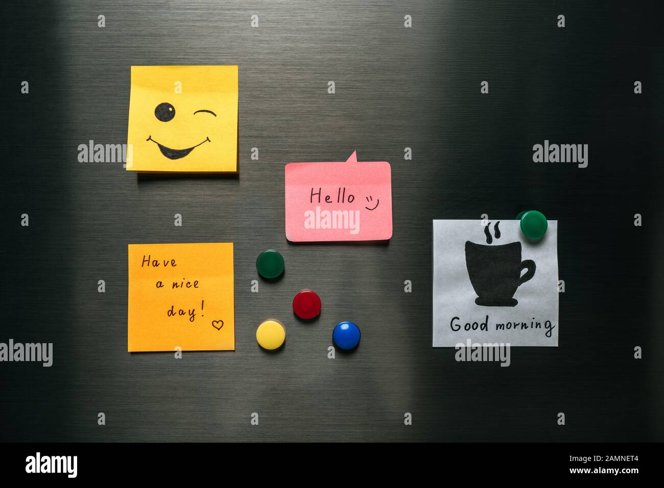 notes with wishes and magnets hanging on fridge Stock Photo - Alamy