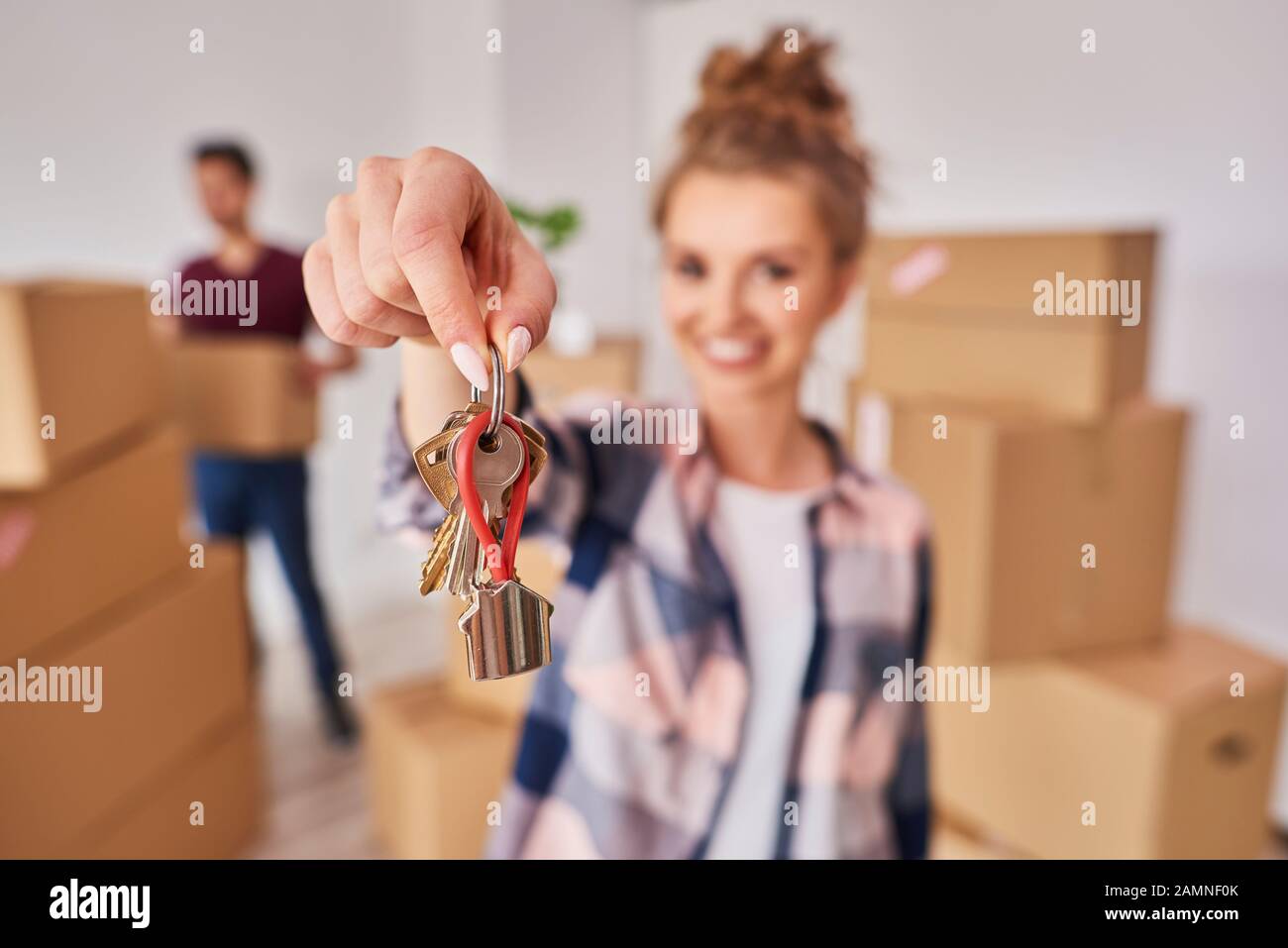 Womans hand showing keys from hi-res stock photography and images - Alamy