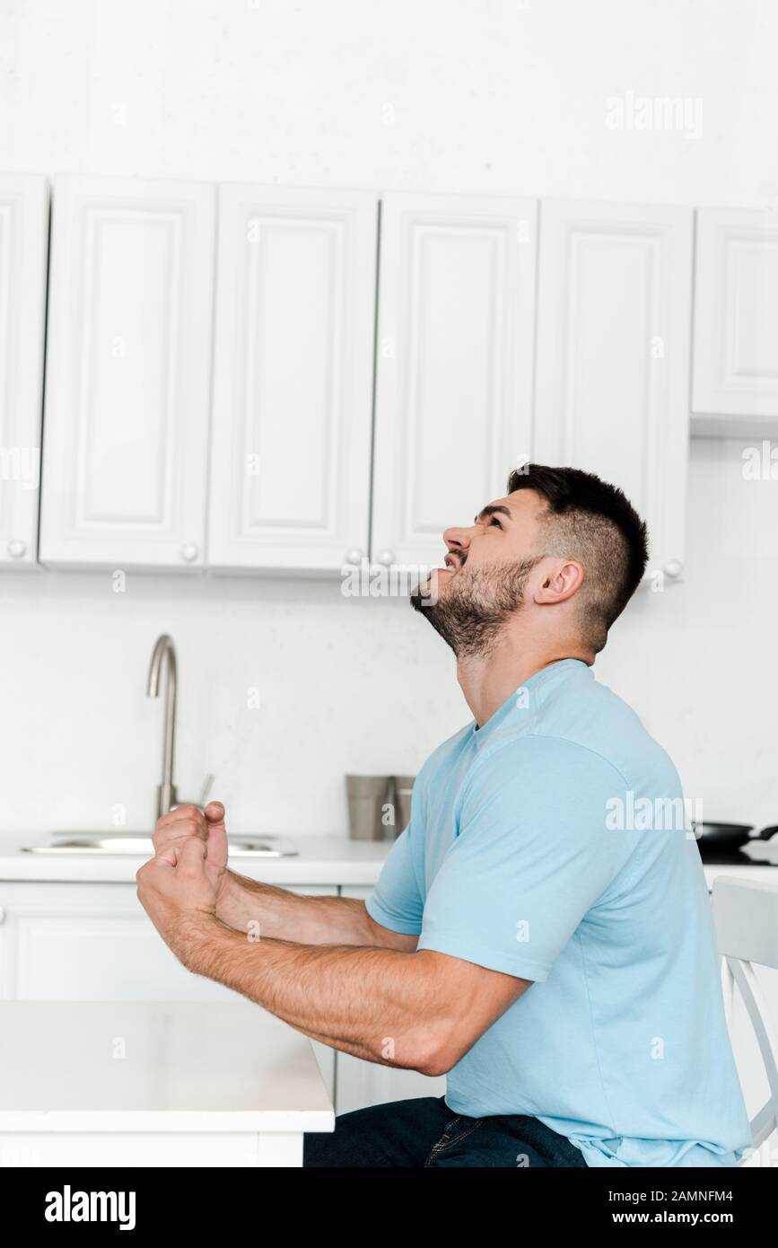 Man sitting in chair screaming hi-res stock photography and images - Alamy