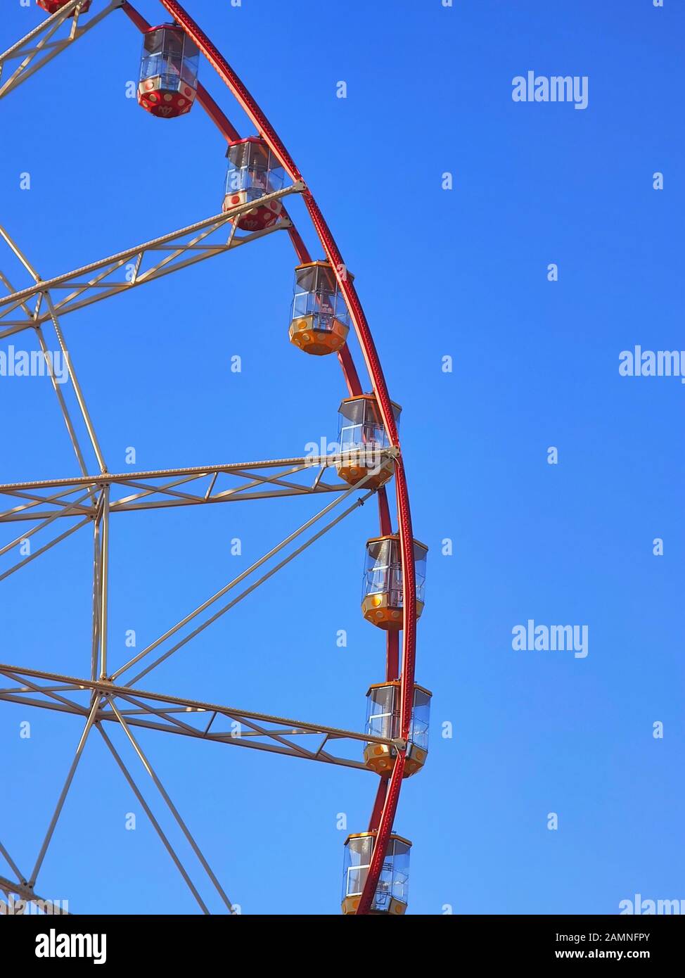 Vertical image with close-up of section of colorful bright red, yellow ...