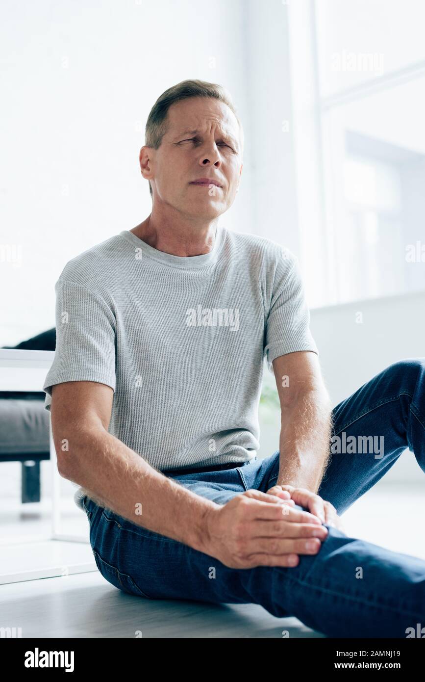 Man feeling emotional pain sitting hi-res stock photography and images ...