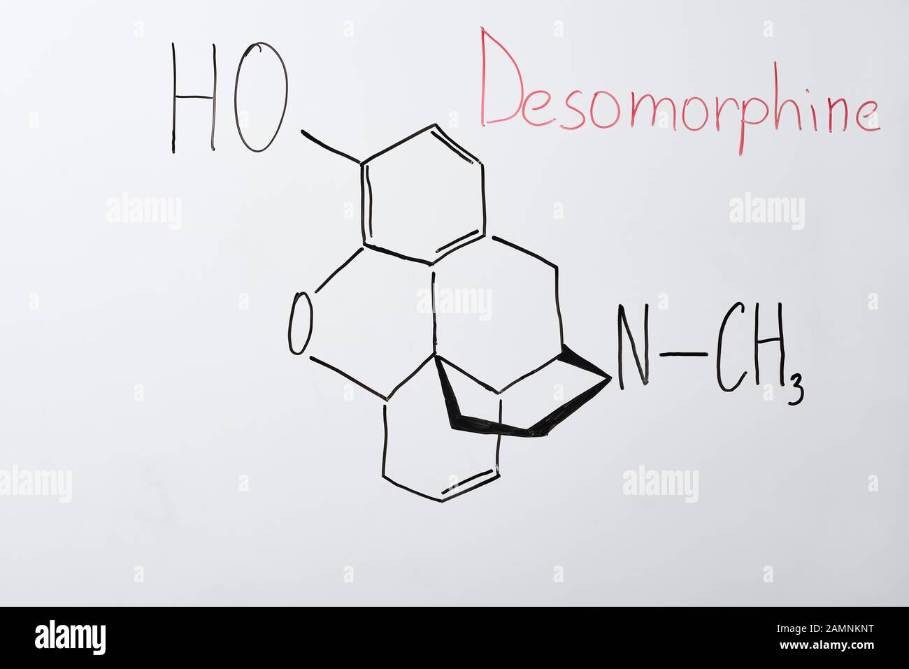 top view of white board with chemical formula and lettering ...