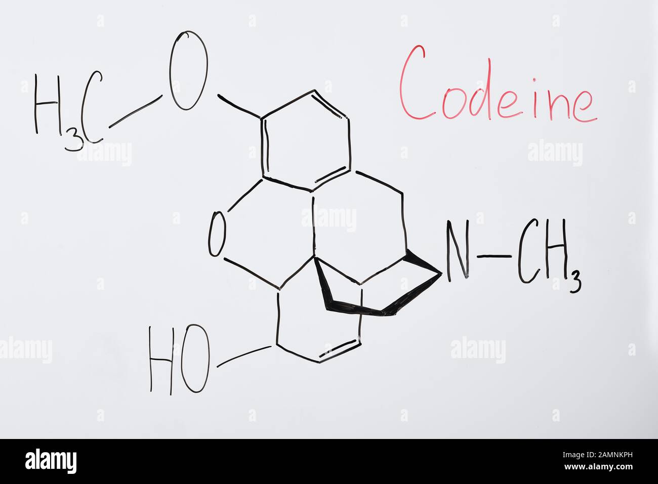 top view of white board with chemical formula and lettering codeine ...