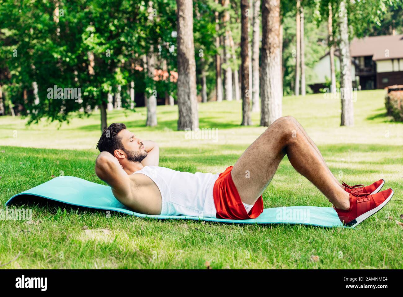 Handsome sportsman doing side hi-res stock photography and images - Alamy