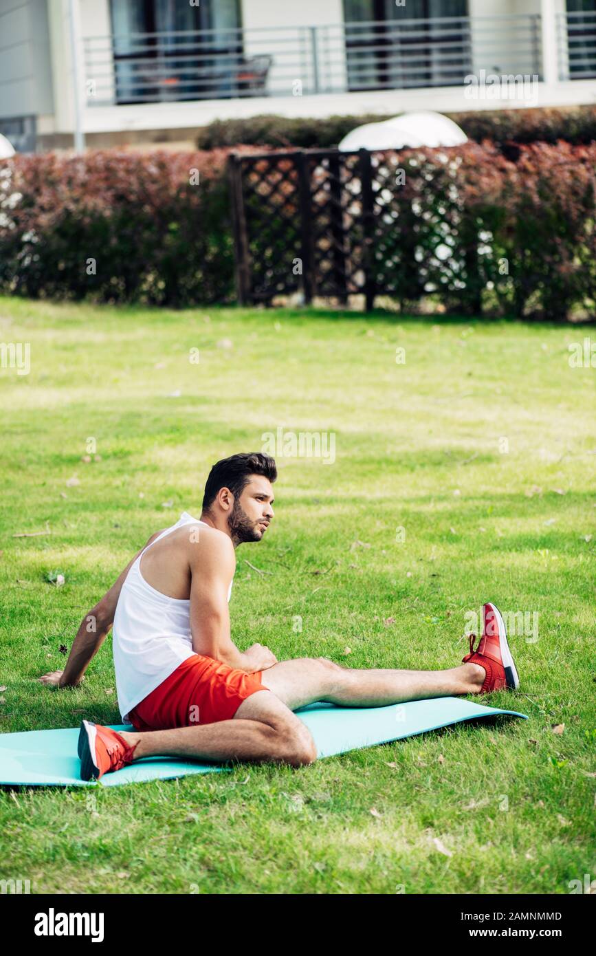 Man sitting on fitness hi-res stock photography and images - Alamy